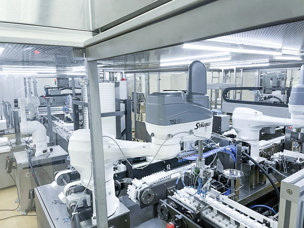 Inspection and packing of prefilled syringes