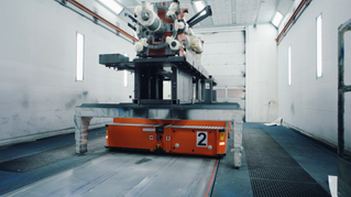 Automation of injection molding machines with mobile robotics solution