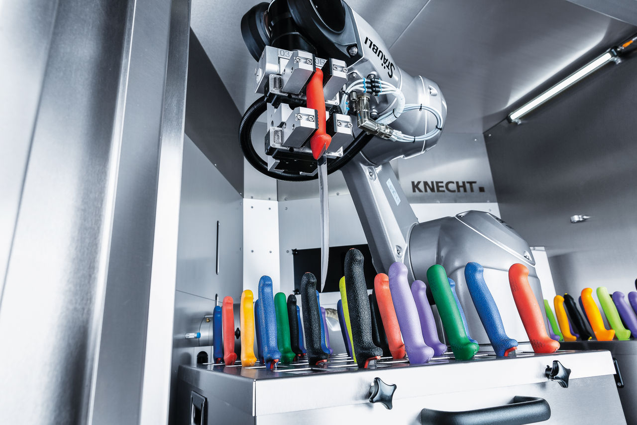 Sharpening knives with a robot